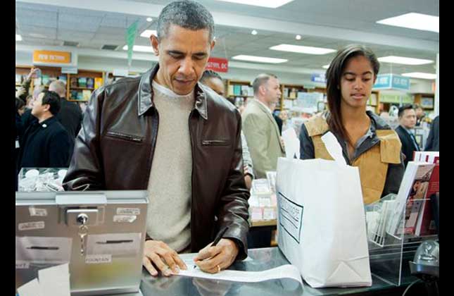 Barack Obama- the complete family man, does shopping with daughters
