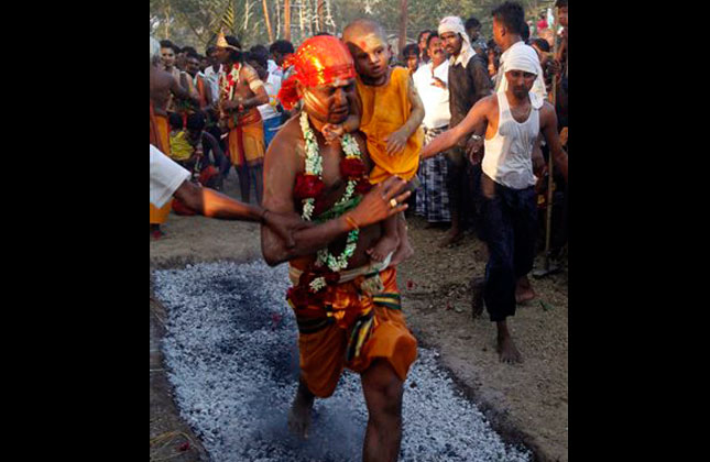 People in Myanmar walk on fire in Hindu festival